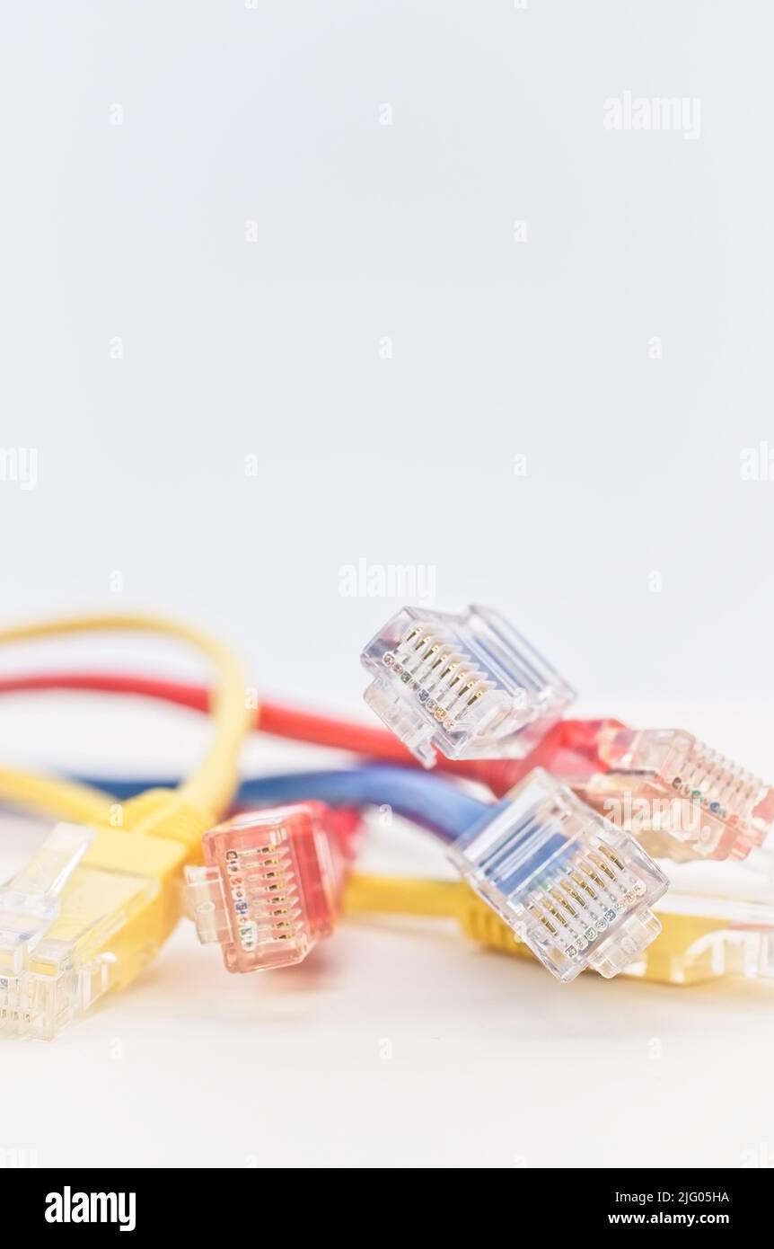 gigabit networking cables with RJ45 connectors on a bright white desk ...