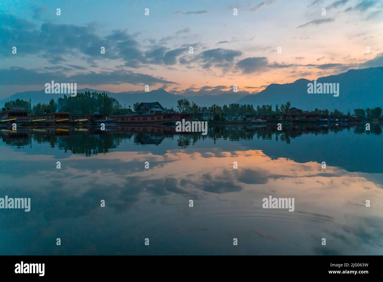 Panoramic view showing Dal Lake with reflection of cloudy sky and ...