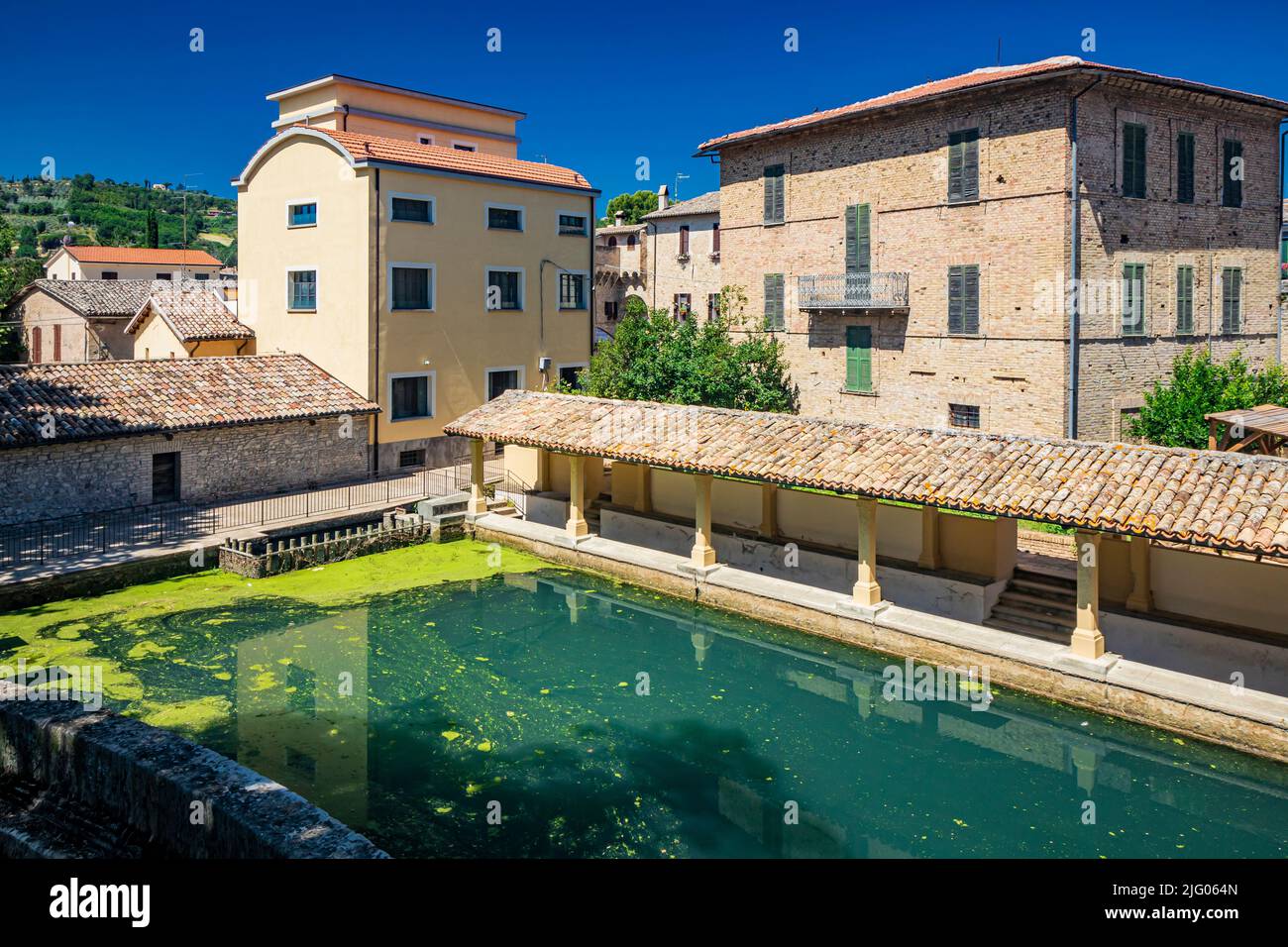 The ancient wash house, on the river, in the medieval village of ...