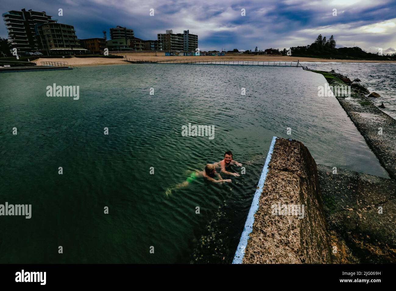 Kids swimming in the Ocean Baths swimming pool at Forster, New South ...
