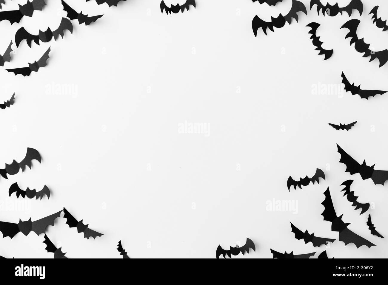 flock of black paper bats over white background Stock Photo - Alamy