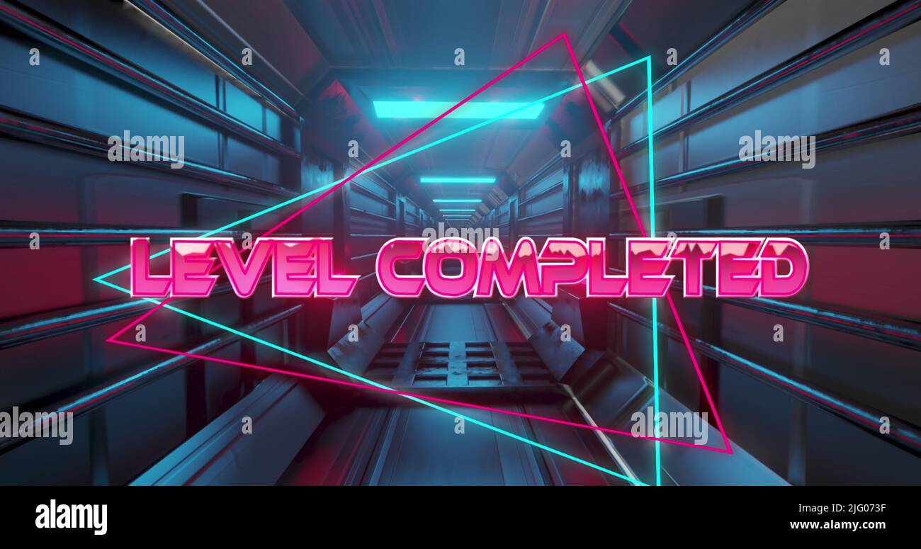 Image of level completed text over digital tunnel Stock Photo - Alamy
