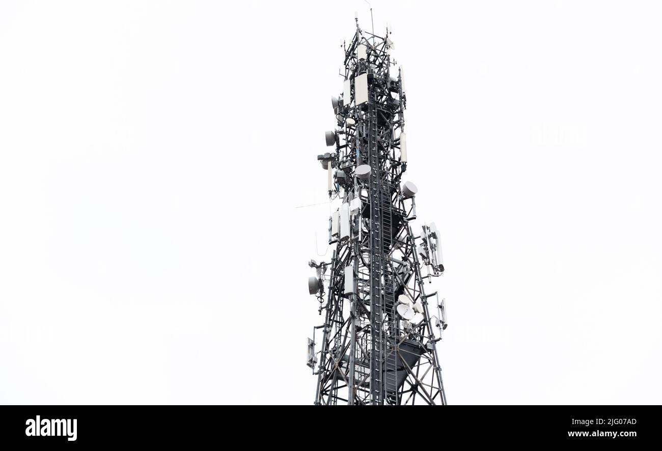 Cell phone relay tower. Metal mast. Metal structure with mounted relays ...
