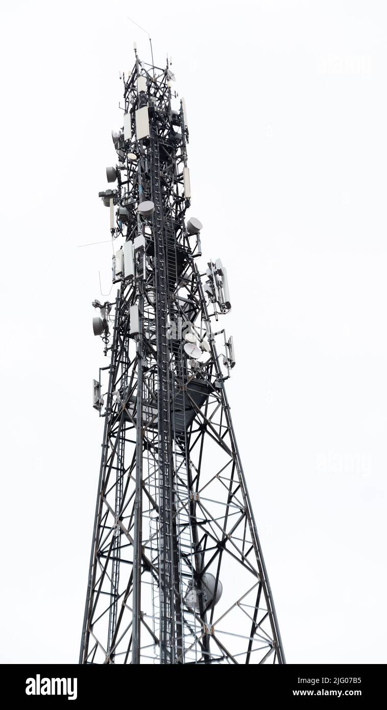 Cell phone relay tower. Metal mast. Metal structure with mounted relays ...