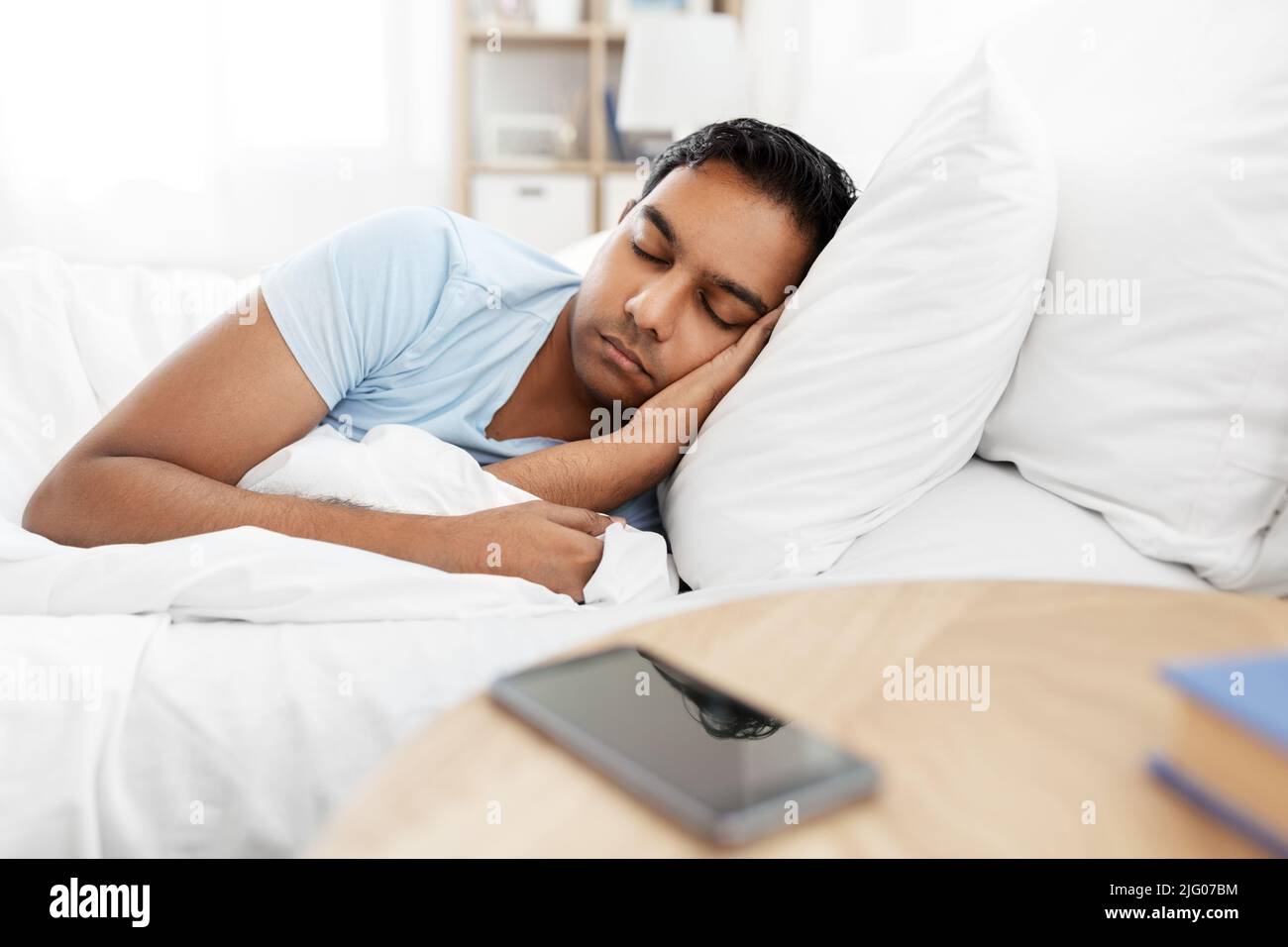 Indian man sleeping in bed hi-res stock photography and images - Alamy