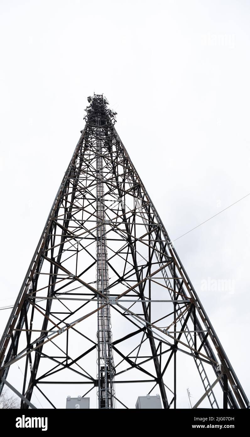 Cell phone relay tower. Metal mast. Metal structure with mounted relays ...