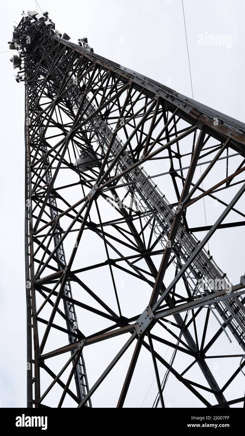 Cell phone relay tower. Metal mast. Metal structure with mounted relays ...