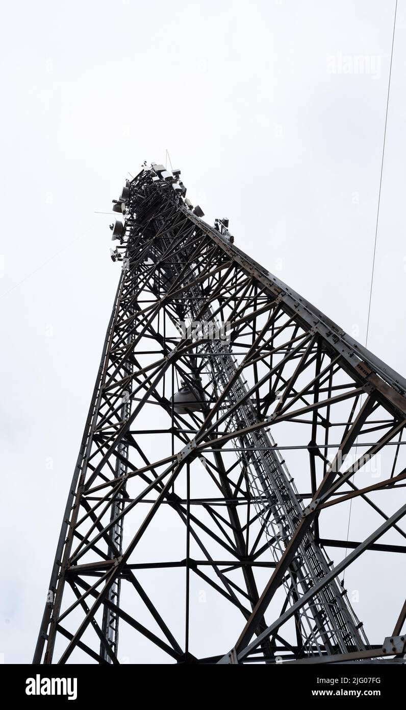 Cell phone relay tower. Metal mast. Metal structure with mounted relays ...