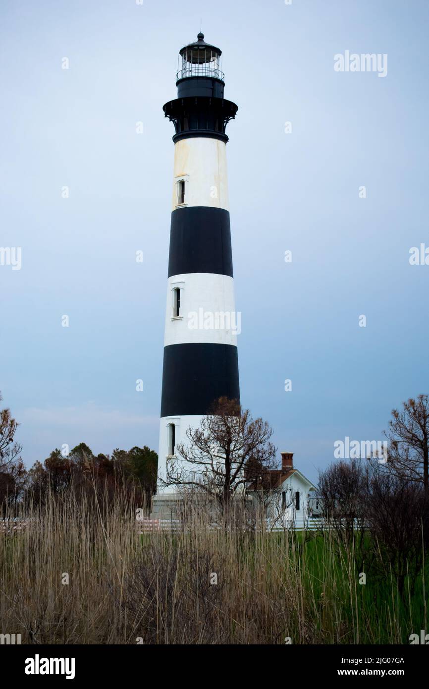 A vertical shot of a black and white striped lighthouse Stock Photo - Alamy