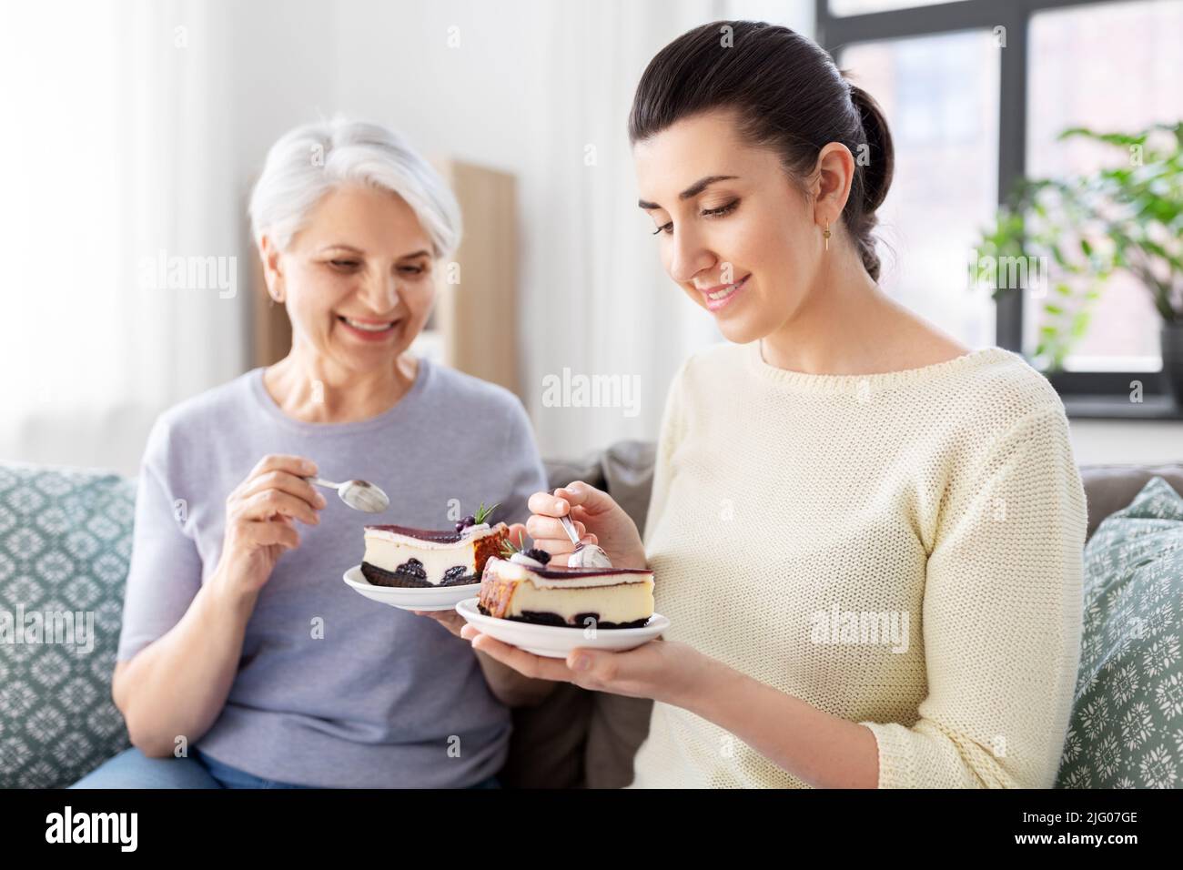 Woman eating cake mature hi-res stock photography and images - Alamy