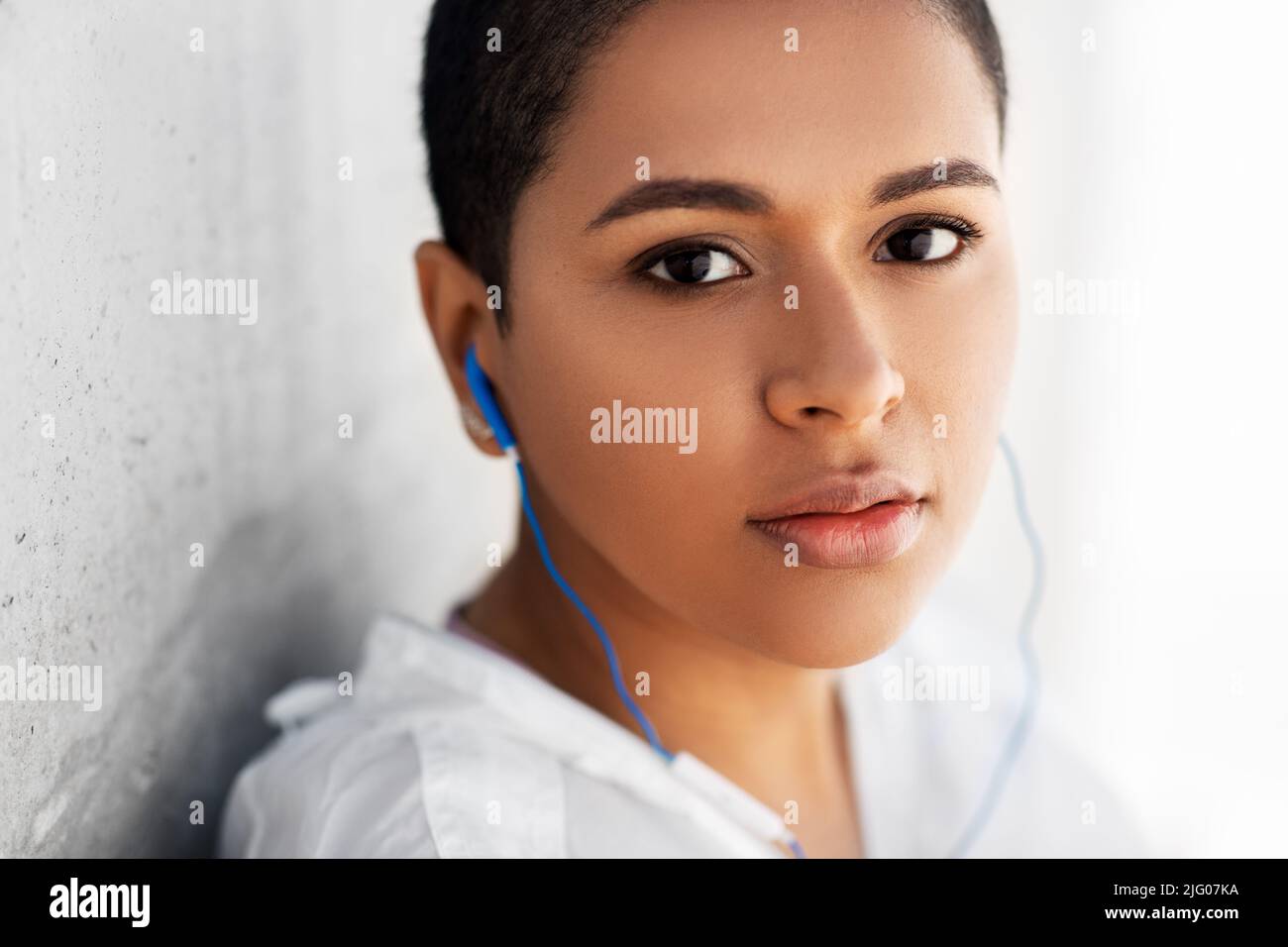 Beautiful woman white earphones hi-res stock photography and images - Alamy