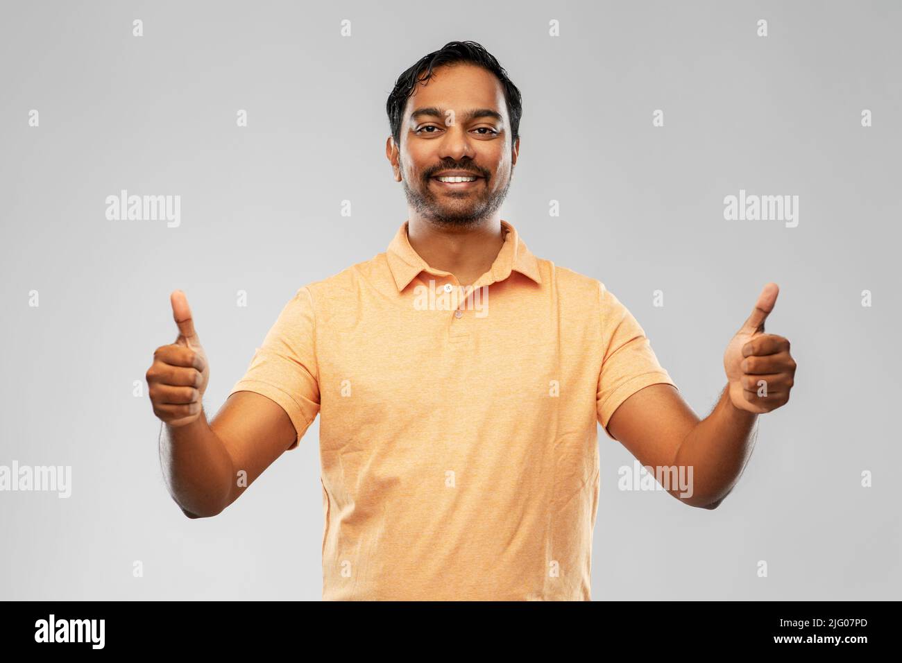 portrait of happy indian man showing thumbs up Stock Photo - Alamy