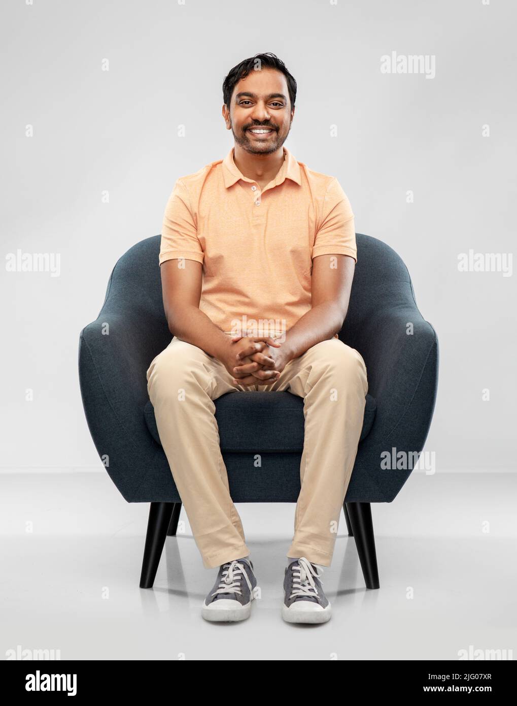 Man sitting indian style hi-res stock photography and images - Alamy
