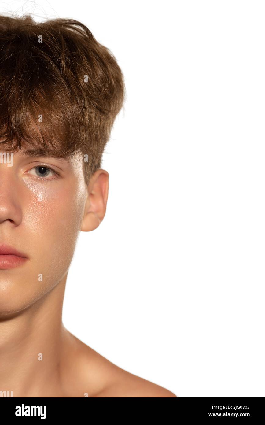 Half of face. Portrait of young handsome man isolated on white studio ...