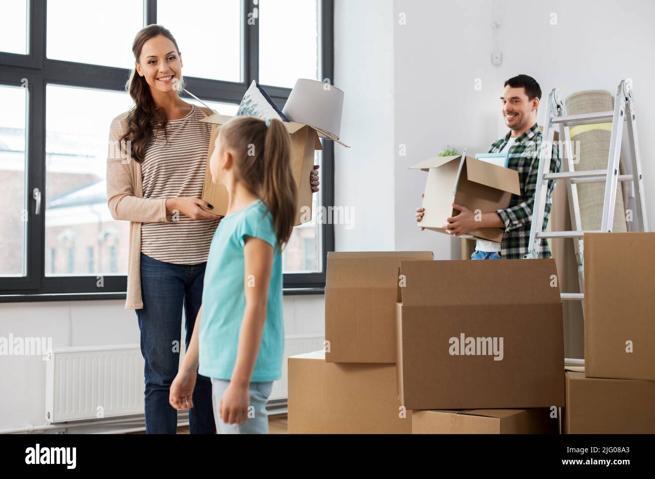 happy family with child moving to new home Stock Photo - Alamy