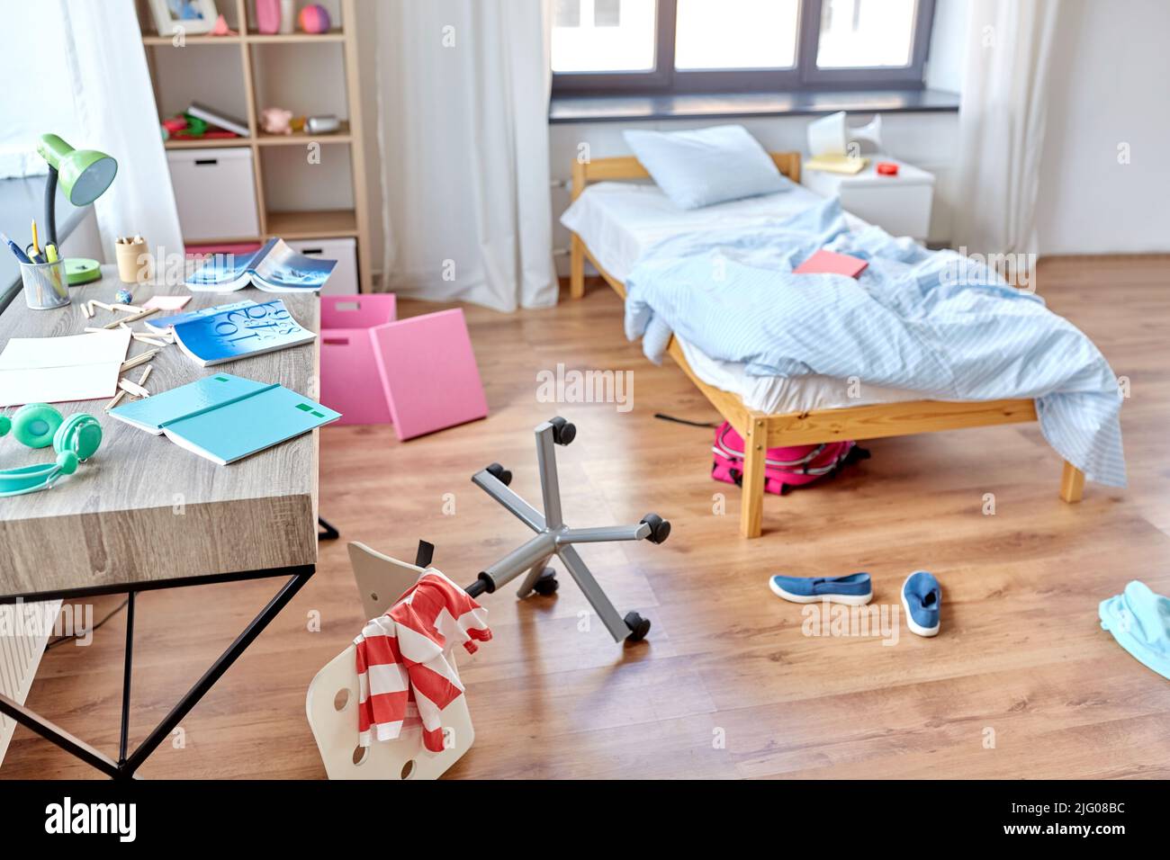 messy home or kid's room with scattered stuff Stock Photo - Alamy