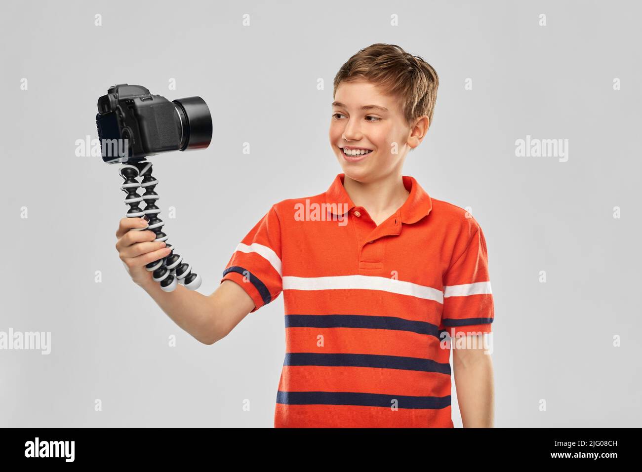 boy video blogger with camera and tripod Stock Photo - Alamy