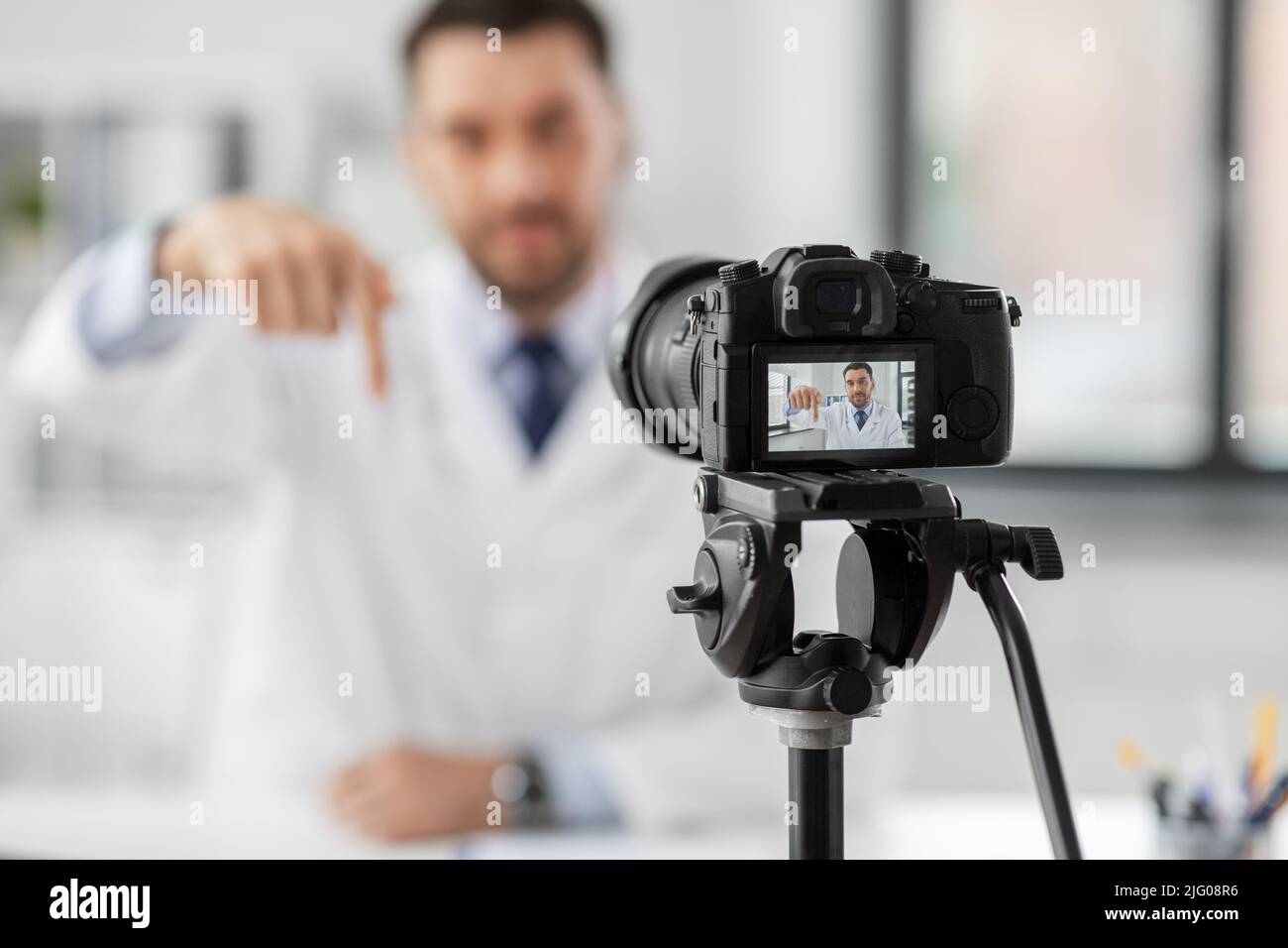 male doctor recording video blog at hospital Stock Photo - Alamy