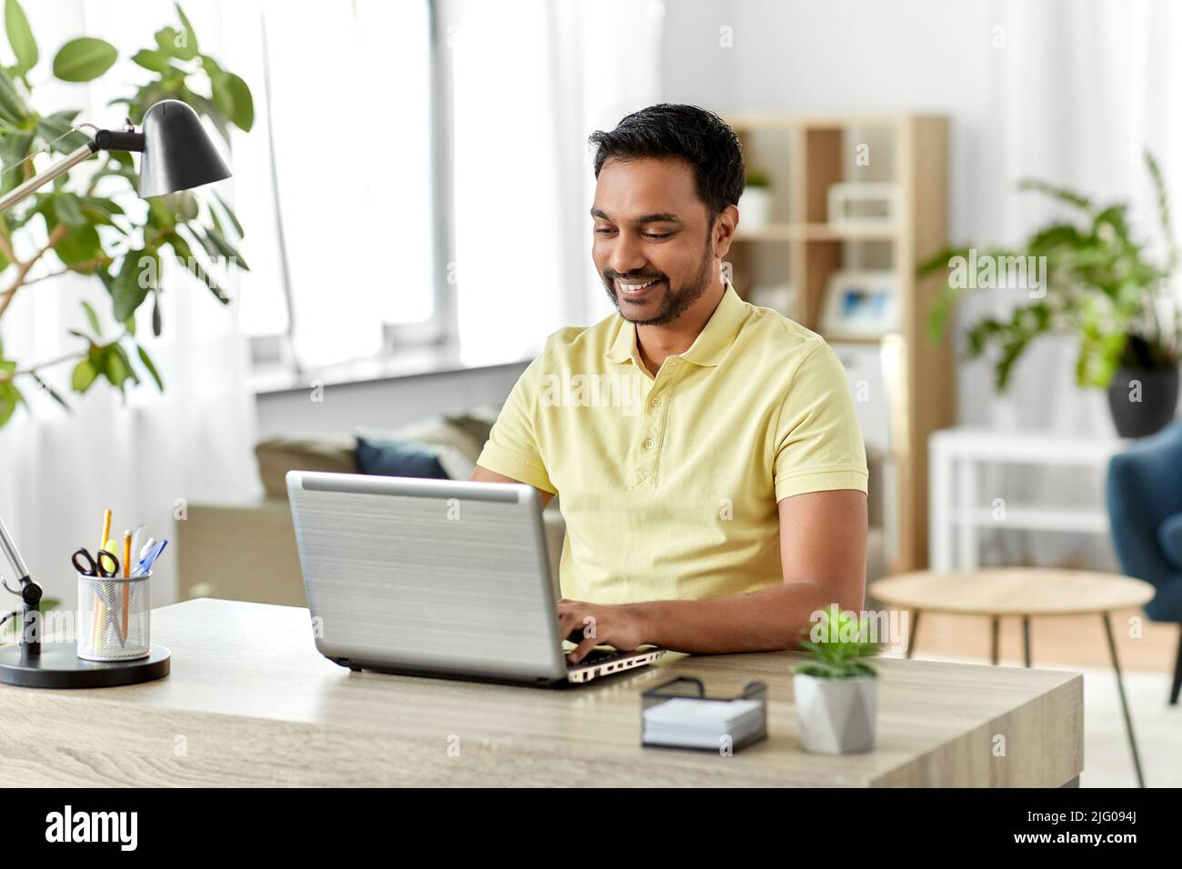 indian man with laptop working at home office Stock Photo - Alamy