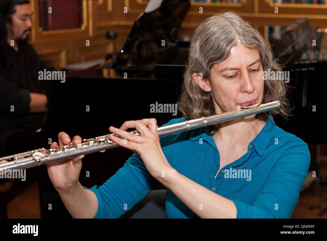 A flautist playing a rehearsal piece for CoMA (Contemporary Music for ...