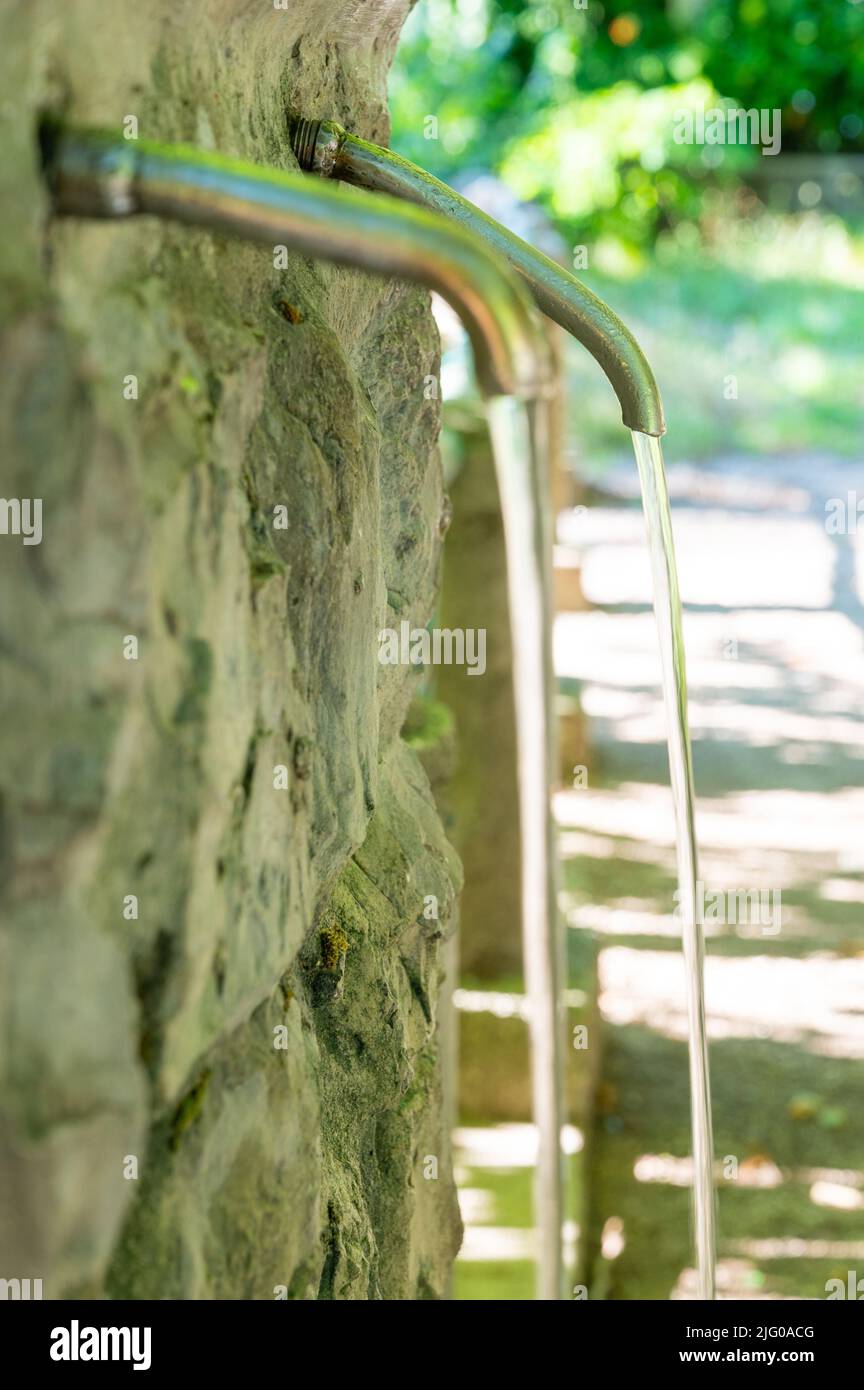 Fountain from which spring water flows. Shortage or abundance of water ...