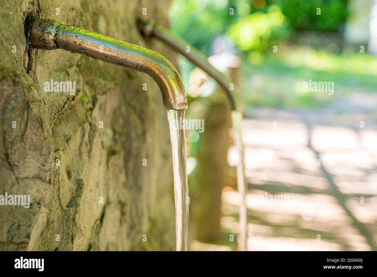 Fountain from which spring water flows. Shortage or abundance of water ...
