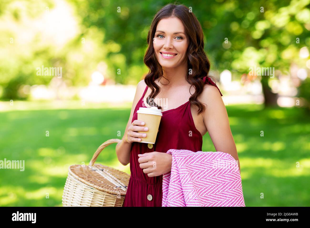 happy woman with picnic basket and coffee at park Stock Photo - Alamy