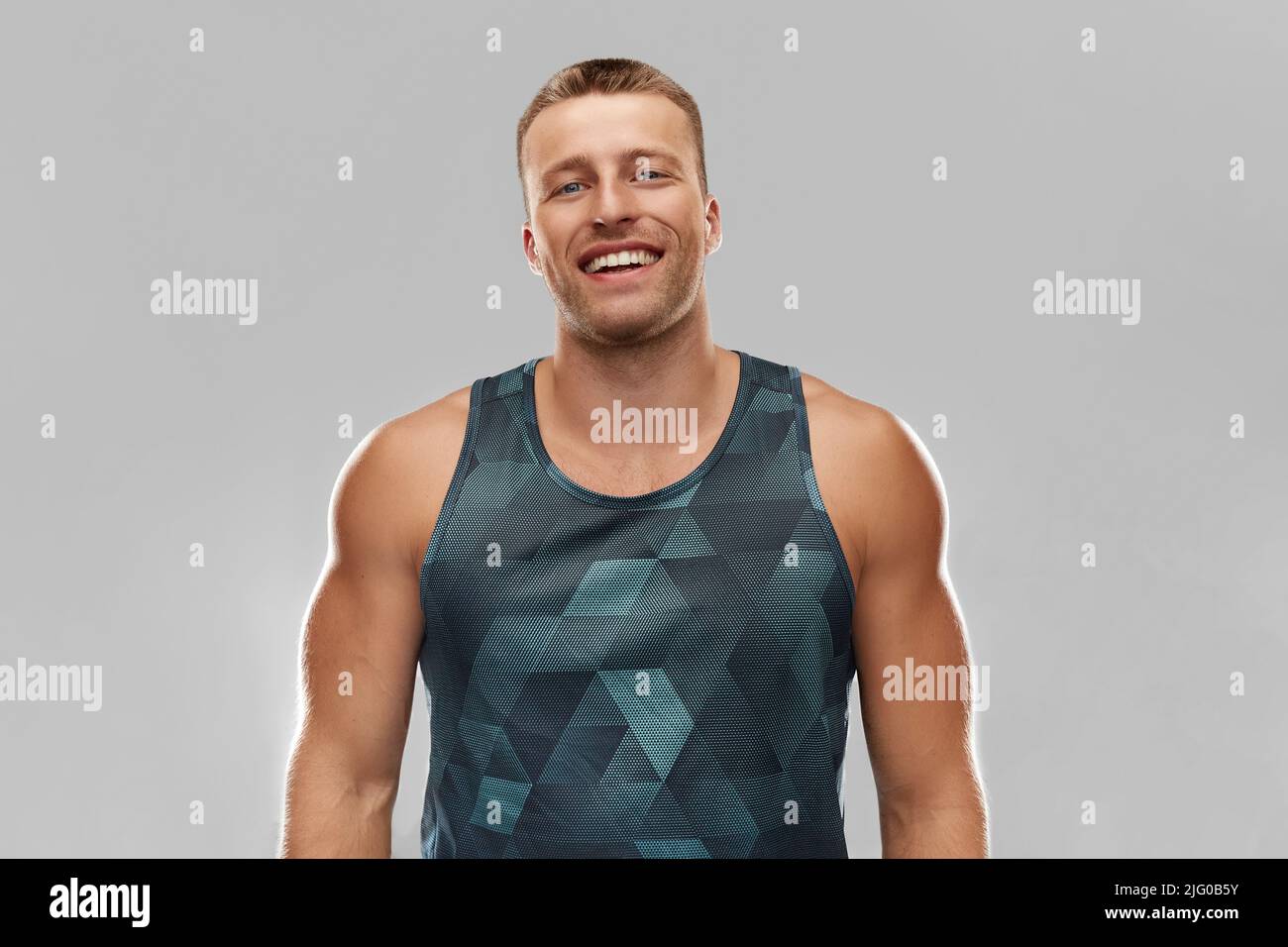 portrait of smiling young man or bodybuilder Stock Photo - Alamy