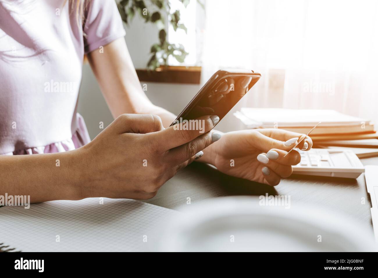 Businesswoman using mobile phone in modern office Stock Photo - Alamy