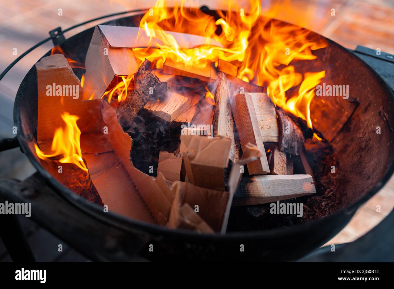 Barbecue grill with fire on open air close up Stock Photo - Alamy