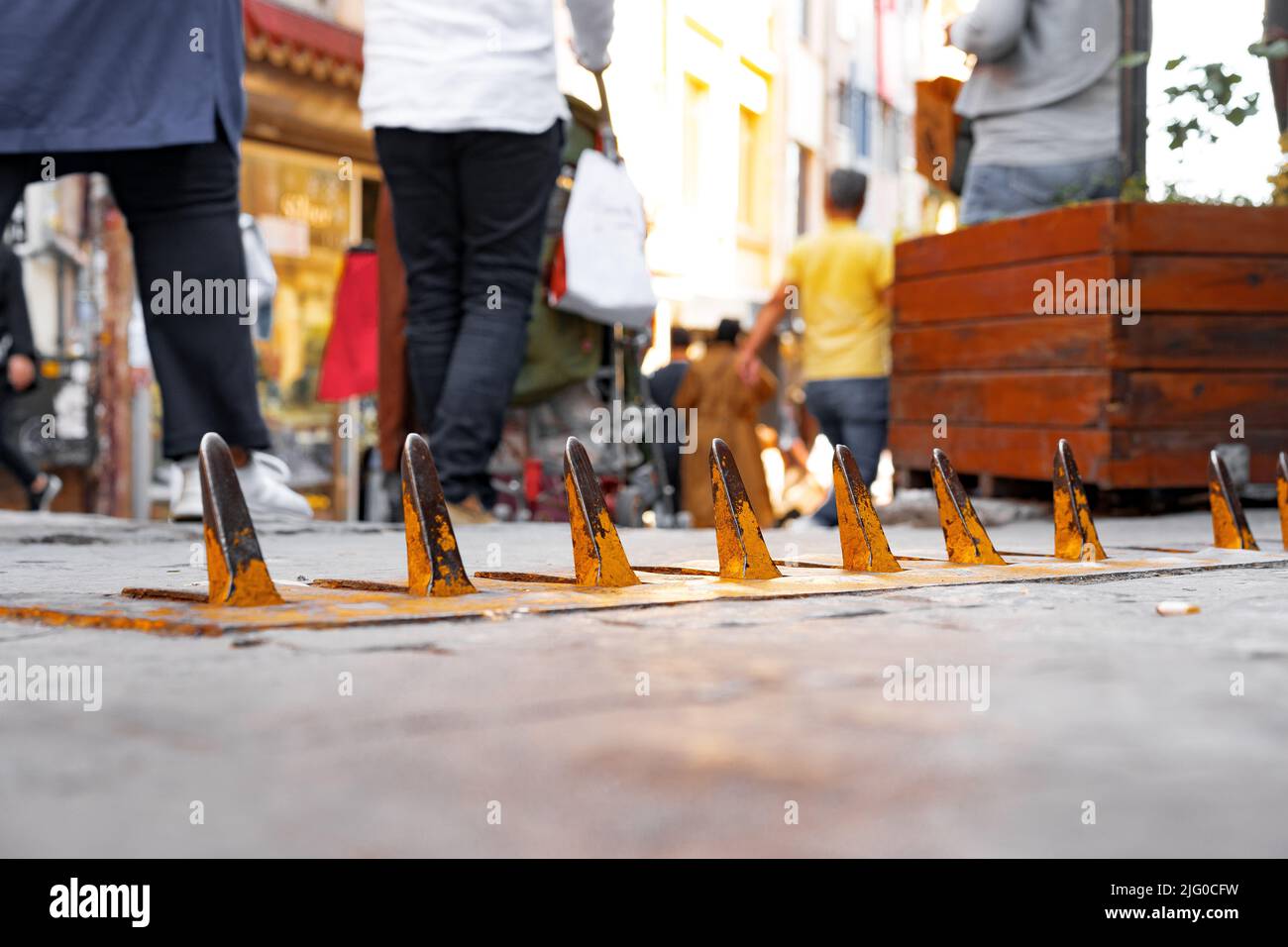 Close-up of yellow spikes for a tire puncture for stopping the car in a ...