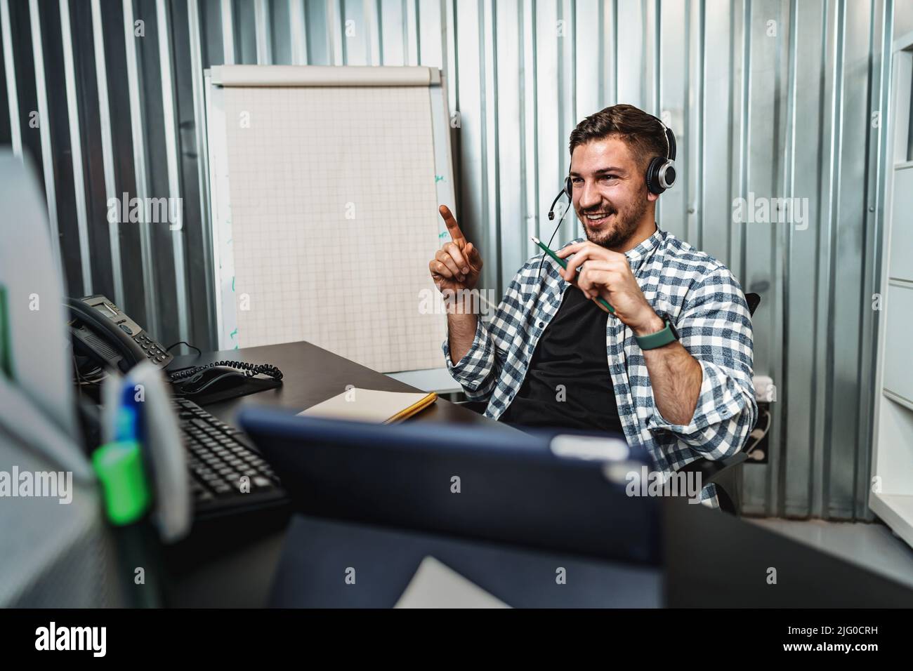 Customer service support operator man with headphones and microphone ...