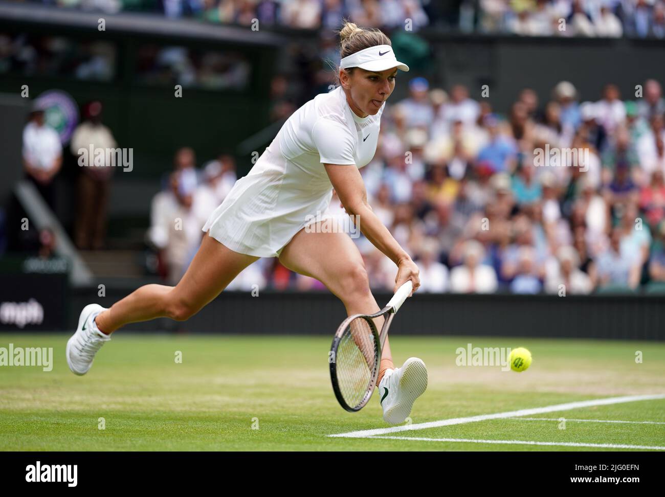 Simona Halep in action against Amanda Anisimova during the Ladies ...