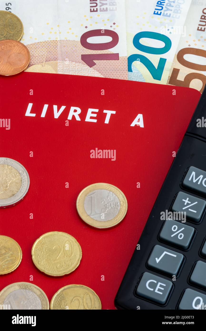 France: Livret A booklet with euro cash and a calculator. The Livret A ...
