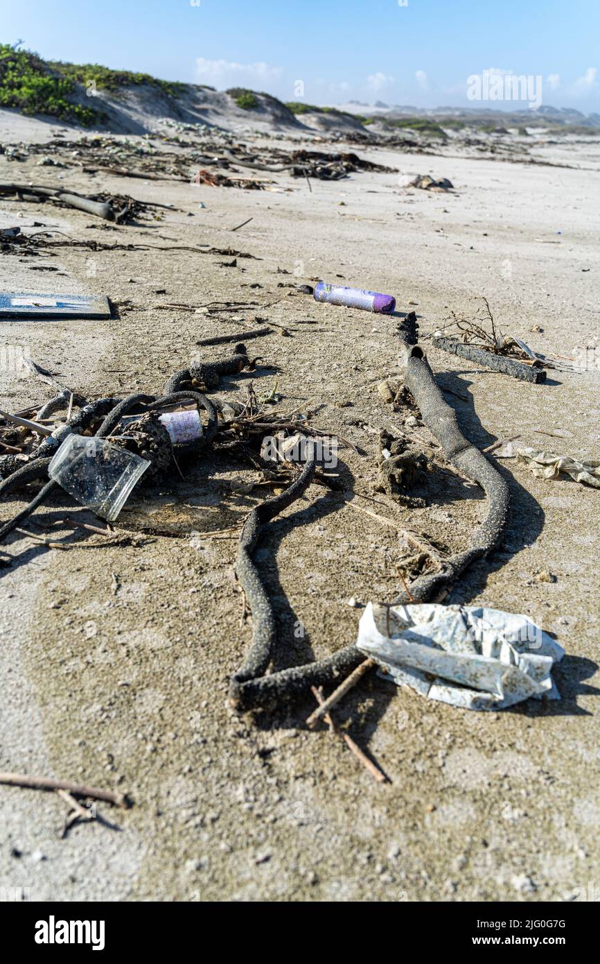 A vertical shot of industrial wastes on the seashore Stock Photo - Alamy