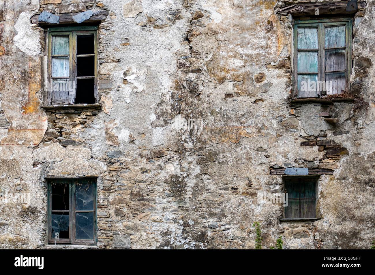The facade of an old and abandoned building with broken windows Stock ...