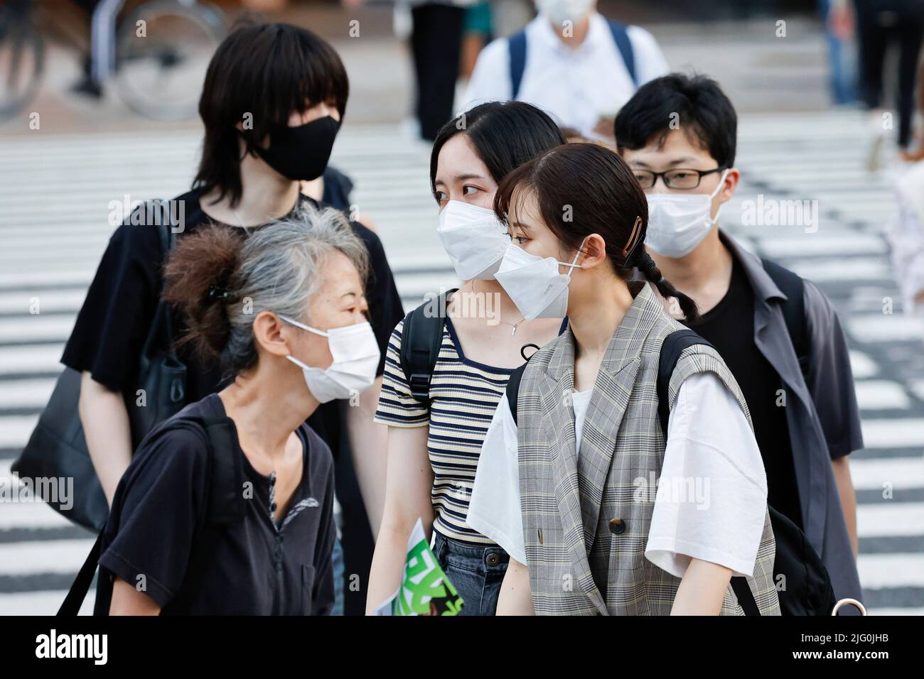 Tokyo, Japan. 6th July, 2022. People wearing protective masks to help ...