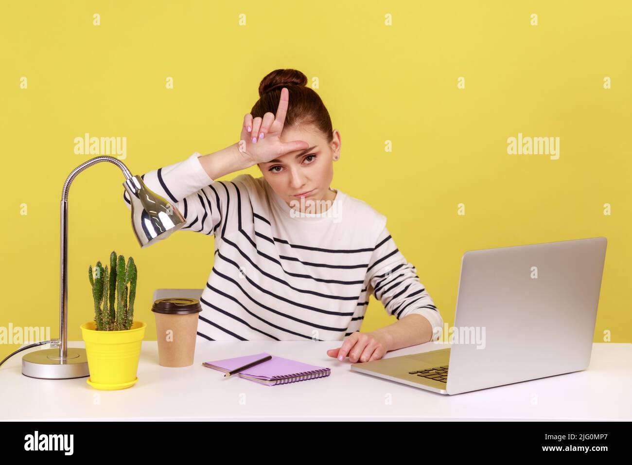 Lost job, unemployment. Depressed woman sitting at workplace and ...