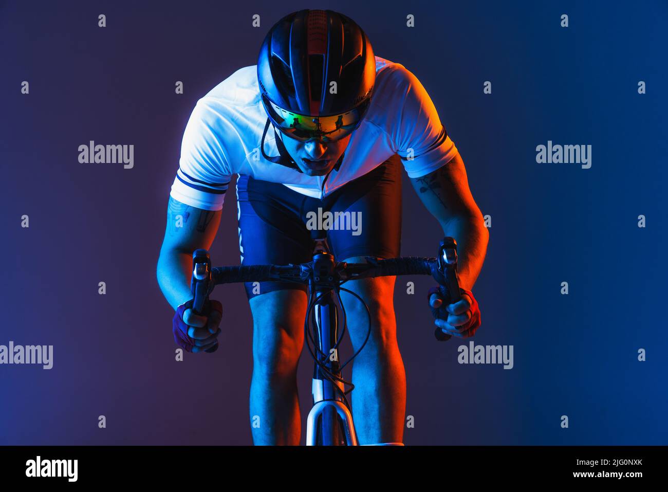 Closeup portrait of professional male cyclist in sports uniform ...