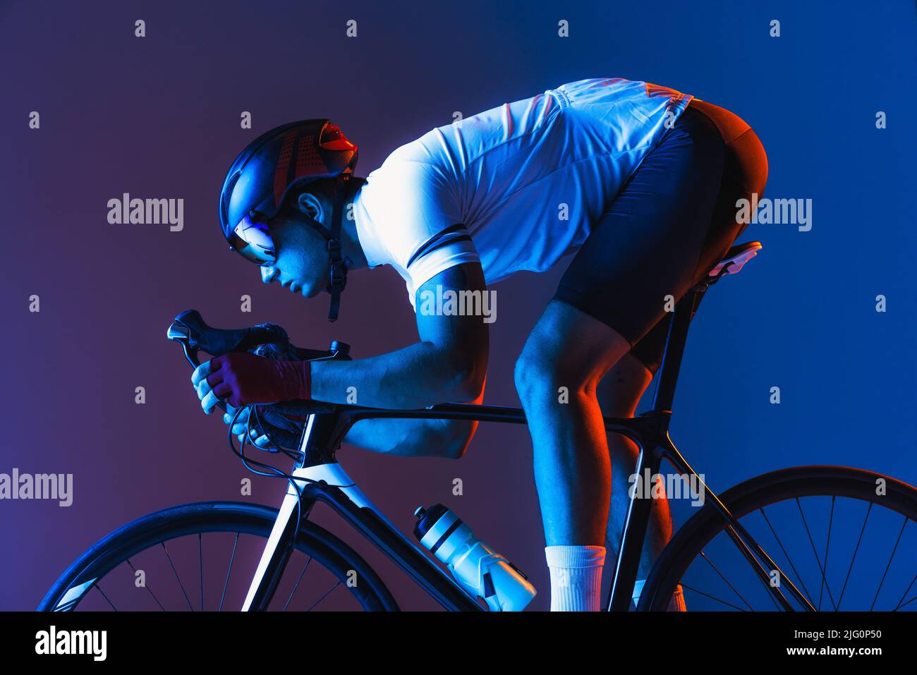 Closeup portrait of professional male cyclist in sports uniform ...