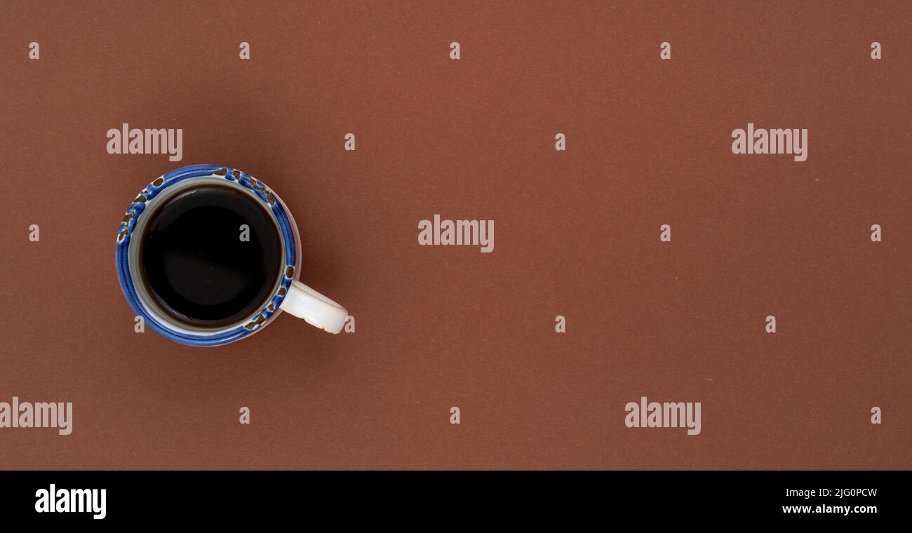 Top view, flat lay of black coffee cup on background brown Stock Photo ...