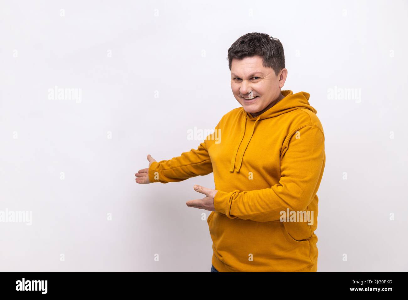 Portrait of satisfied middle aged man with generous smile widely ...