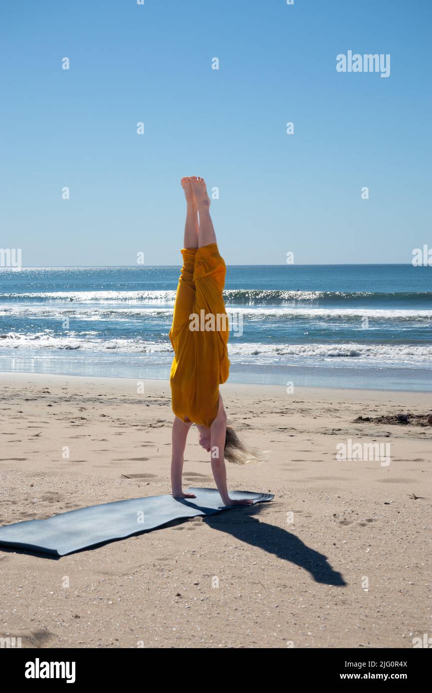 Handstand on beach hi-res stock photography and images - Alamy