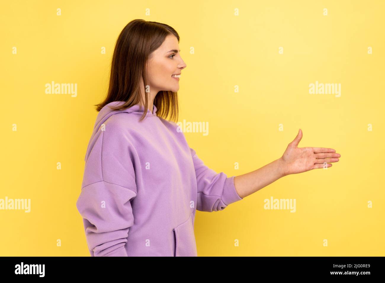 Nice to meet you. Side view of pleased friendly smiling woman ...