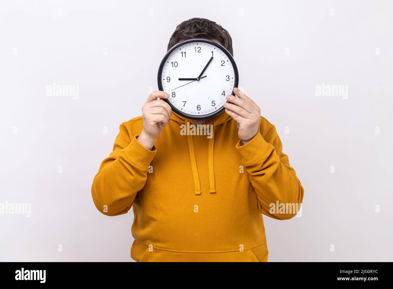 Man with clock hi-res stock photography and images - Alamy