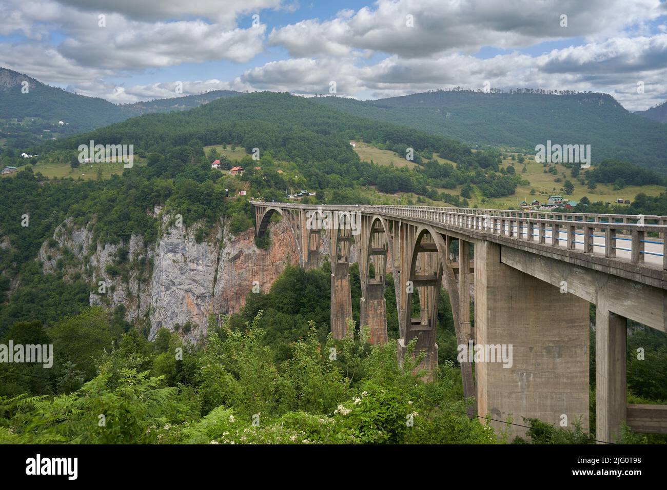 Reinforced concrete bridge over Tara river in mountains. Djurdjevic ...