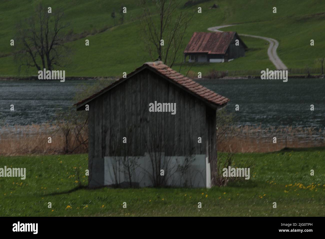 Wooden Barn on a Lake in Switzerland Stock Photo - Alamy