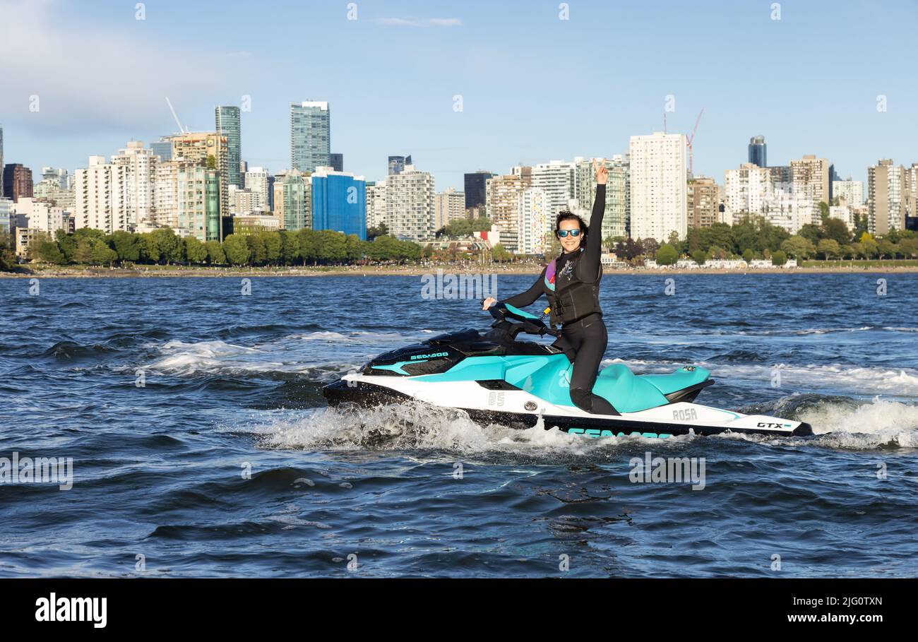 Adventurous Caucasian Woman on Sea-Doo riding in the Ocean Stock Photo ...