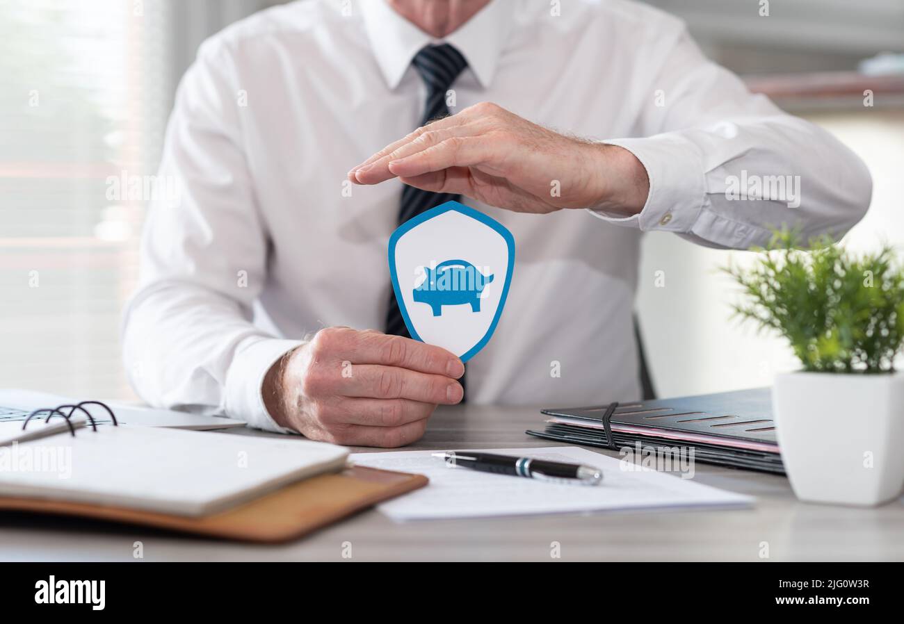 Concept of money protection with paper shield protected by male hand ...