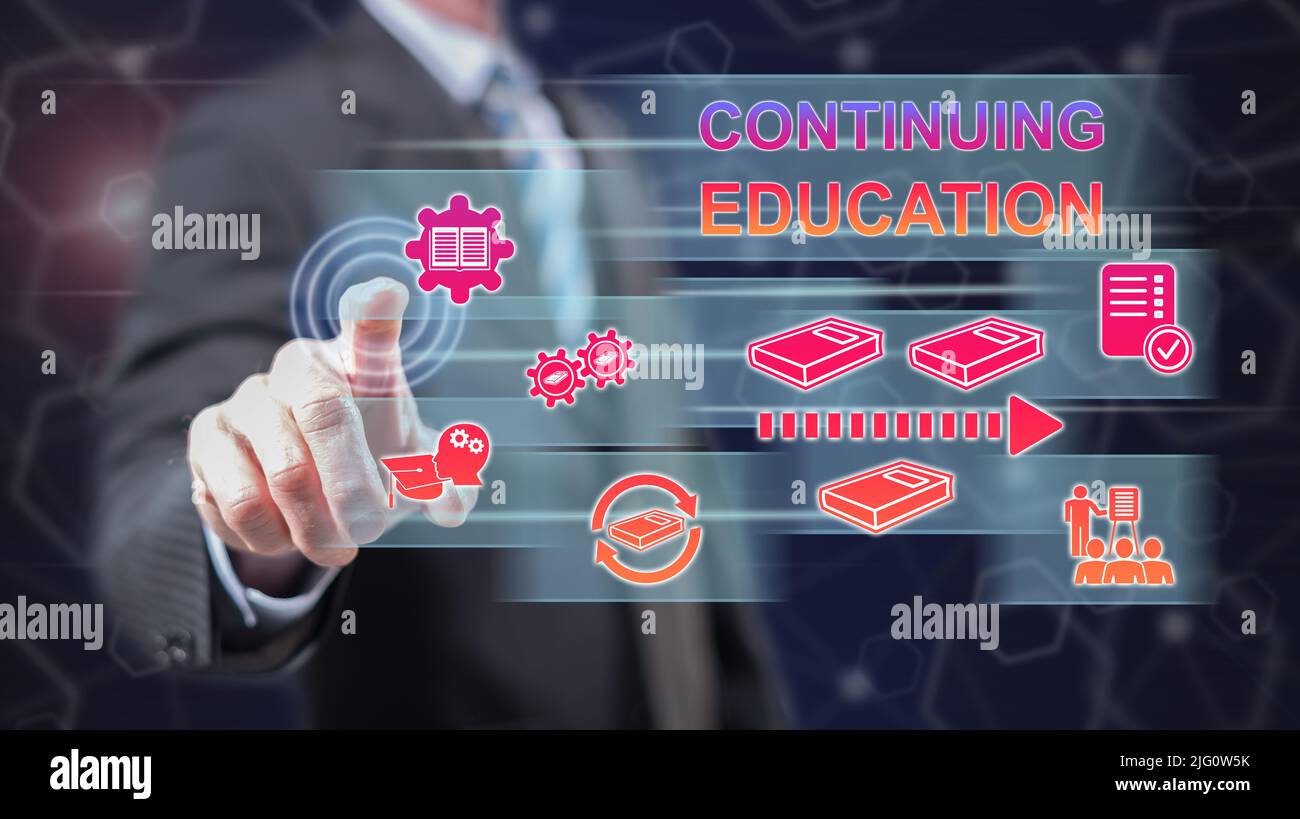 Man touching a continuing education concept on a touch screen with his ...